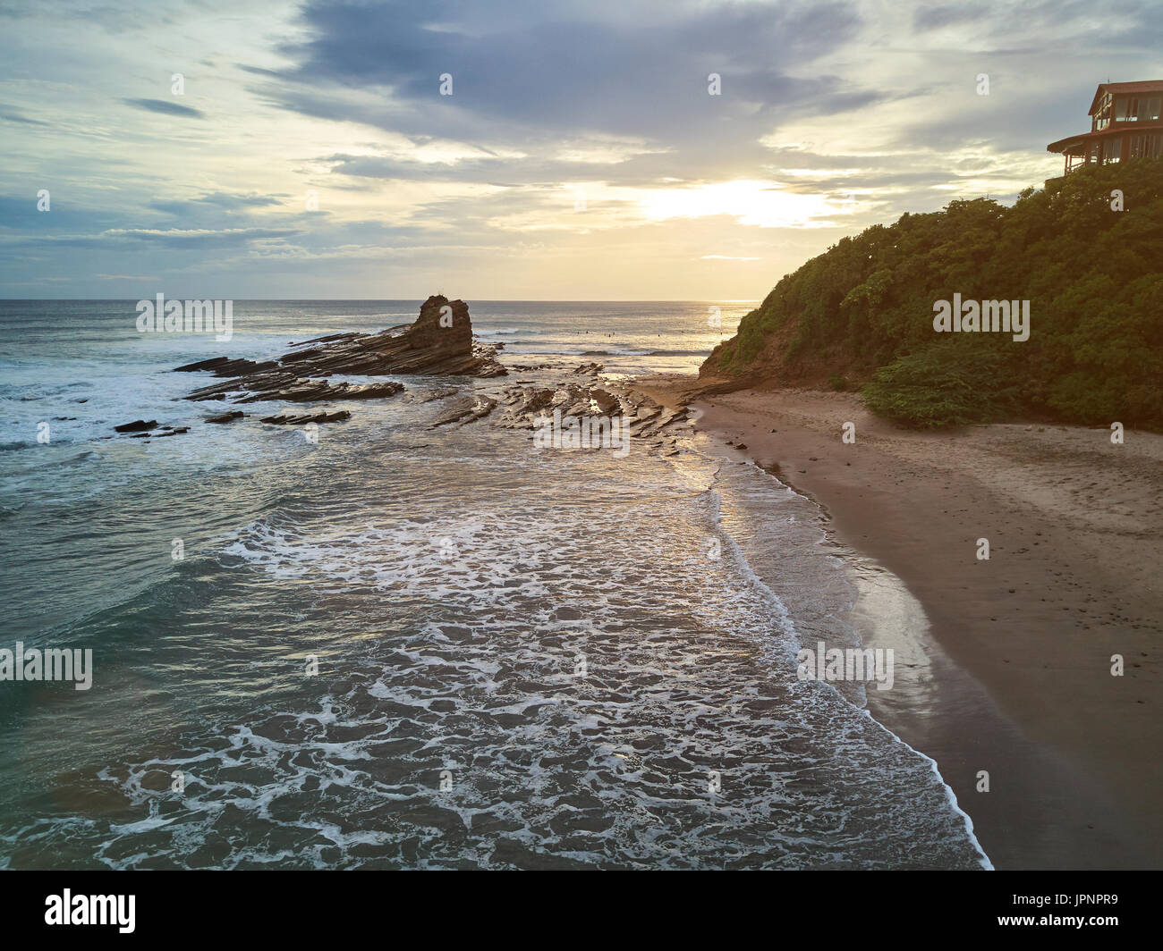Famous place magnific rock for surfers in Nicaragua in sunset light ...