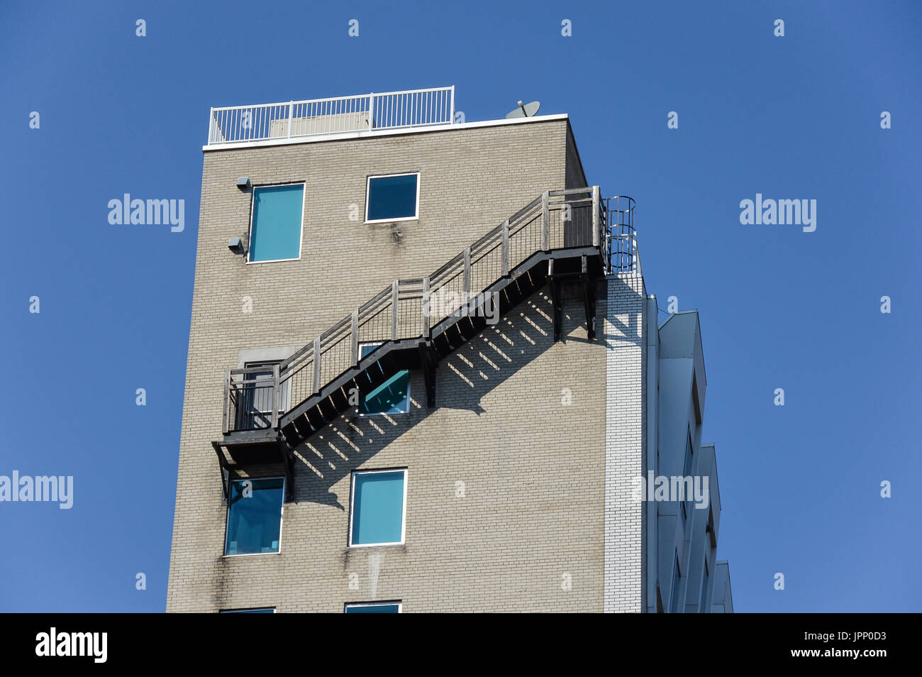 Fire escape ladder on modern building in Montreal downtown, QC, Canada ...