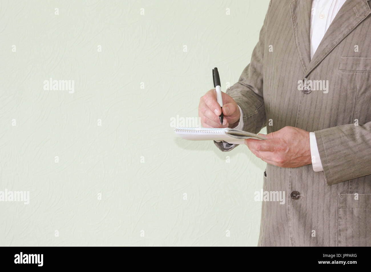 Business concept development strategy. Man with a notebook and pen ...