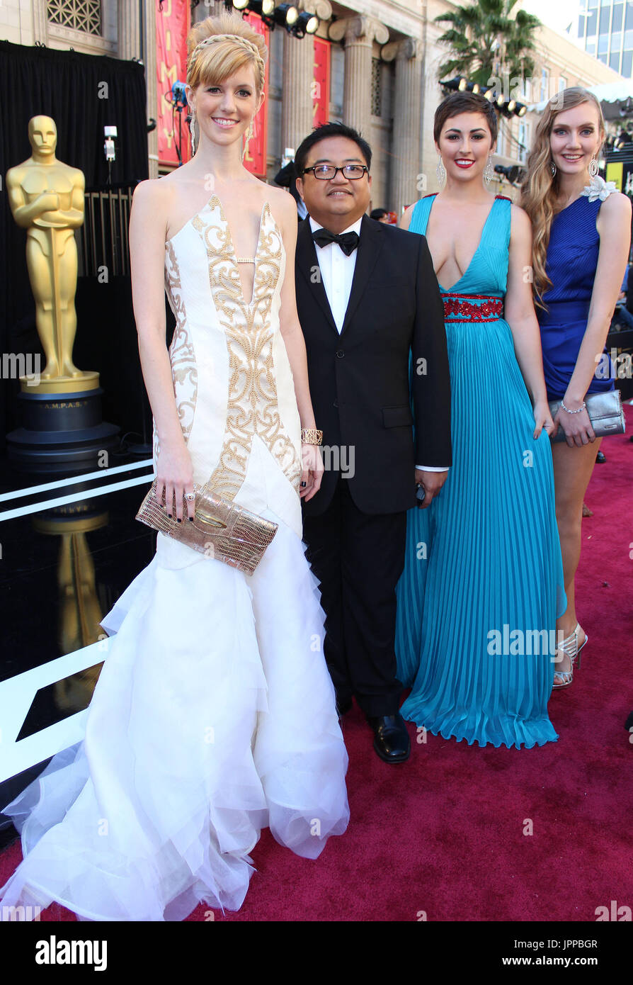 Alexis Monsanto (2nd left) and modelson the red carpet of The Oscars ...
