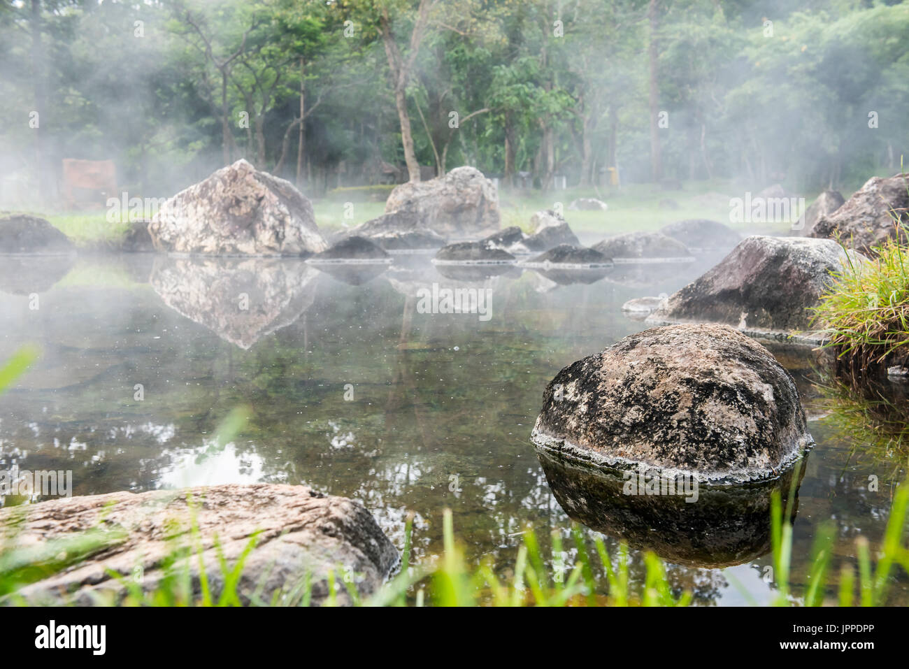 Boil egg in the mineral pool and natural hot water Stock Photo - Alamy
