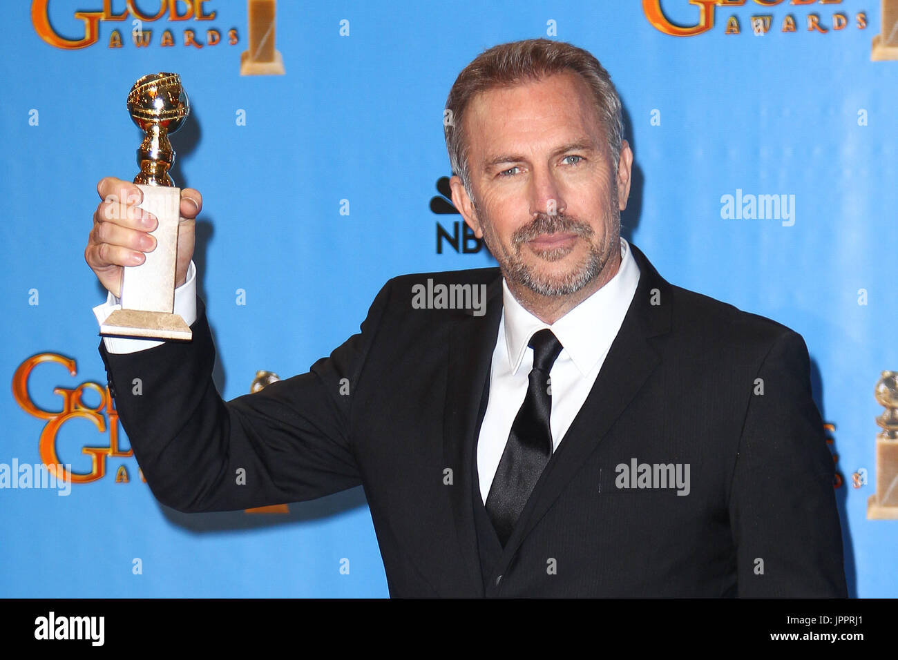 Kevin Costner poses in the press room at the 70th Annual Golden Globe ...