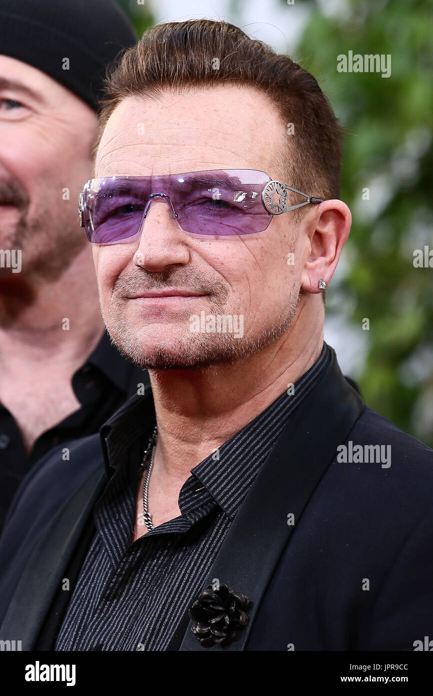 Bono arrives at the 71st Annual Golden Globe Awards held at The Beverly ...
