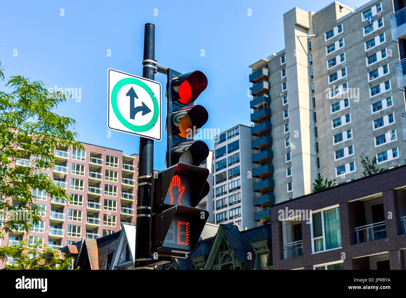 Traffic light in Montreal downtown among the skyscrapers.Red light ...