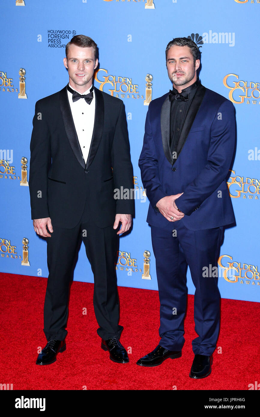 Jesse Spencer and Taylor Kinney poses in the press room backstage at ...
