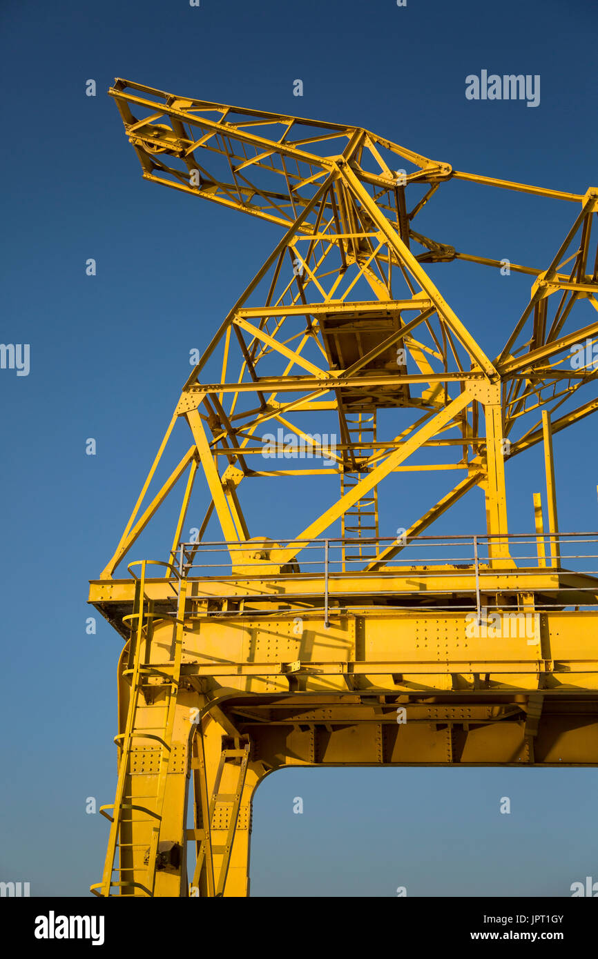 Closeup detail of the yellow dock crane Stock Photo - Alamy