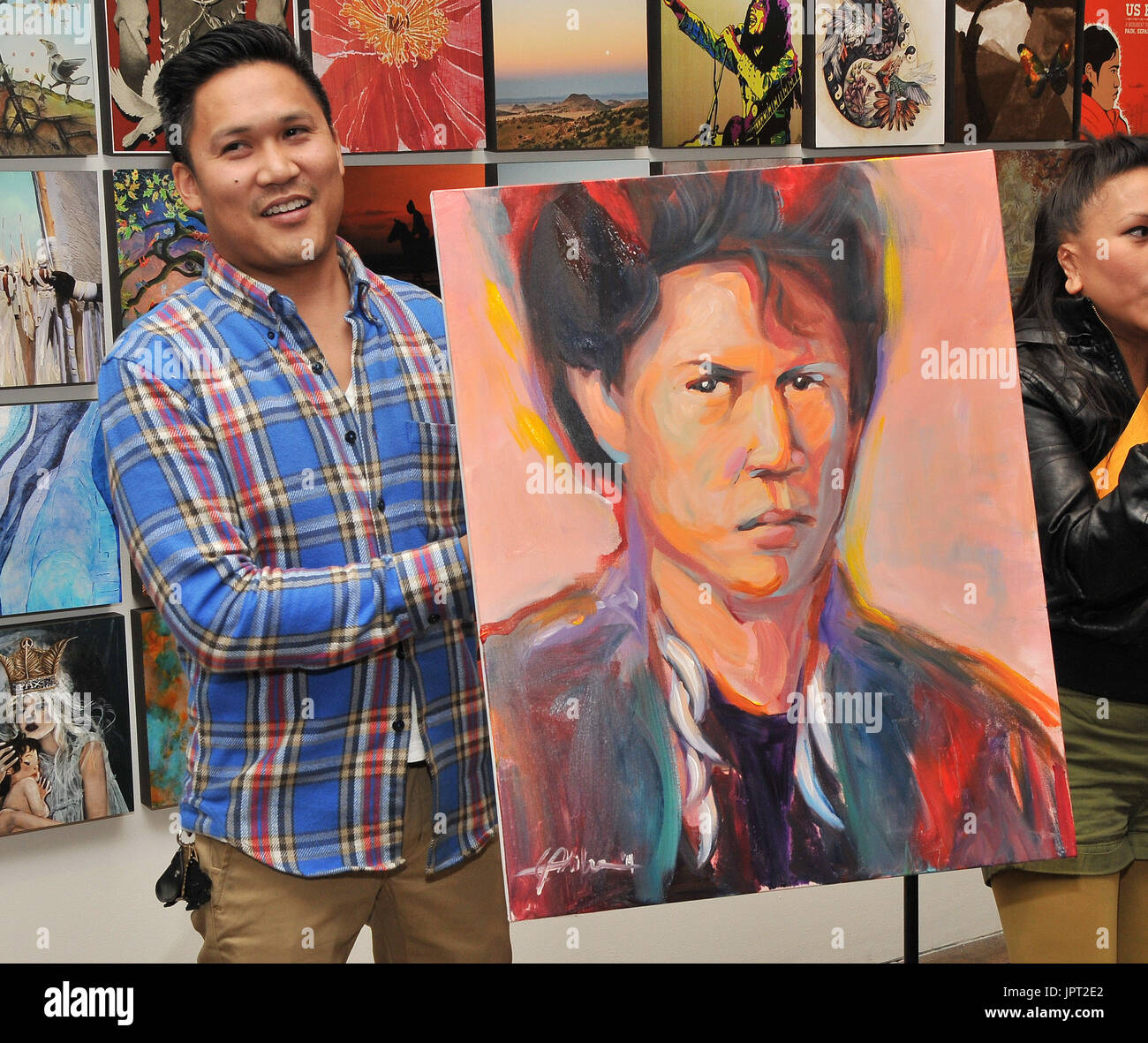 Dante Basco holding up a live painting done by FilAm Artist Eliseo Art ...