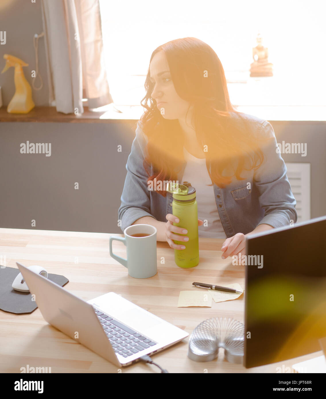 Freelancer working on project remotely. Image with young foxy woman ...