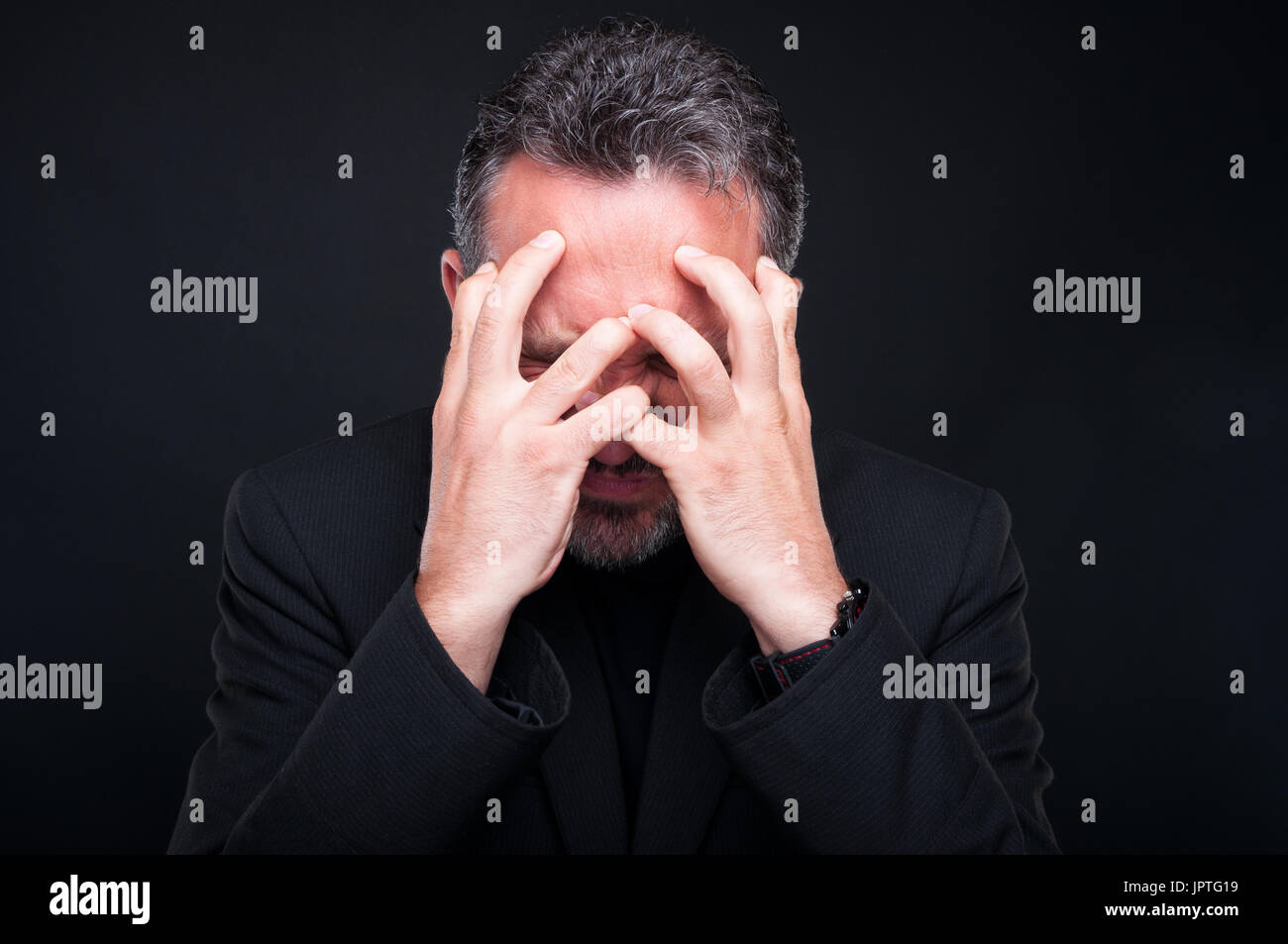 Stressed or tensed classy man looking very angry because of a problem ...