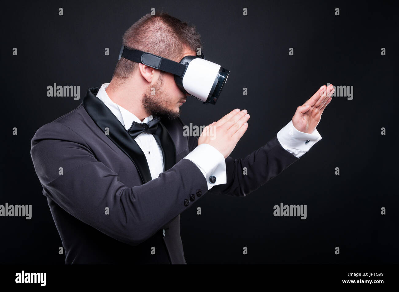 Young gamer fighting in virtual reality world thru vr glasses Stock ...