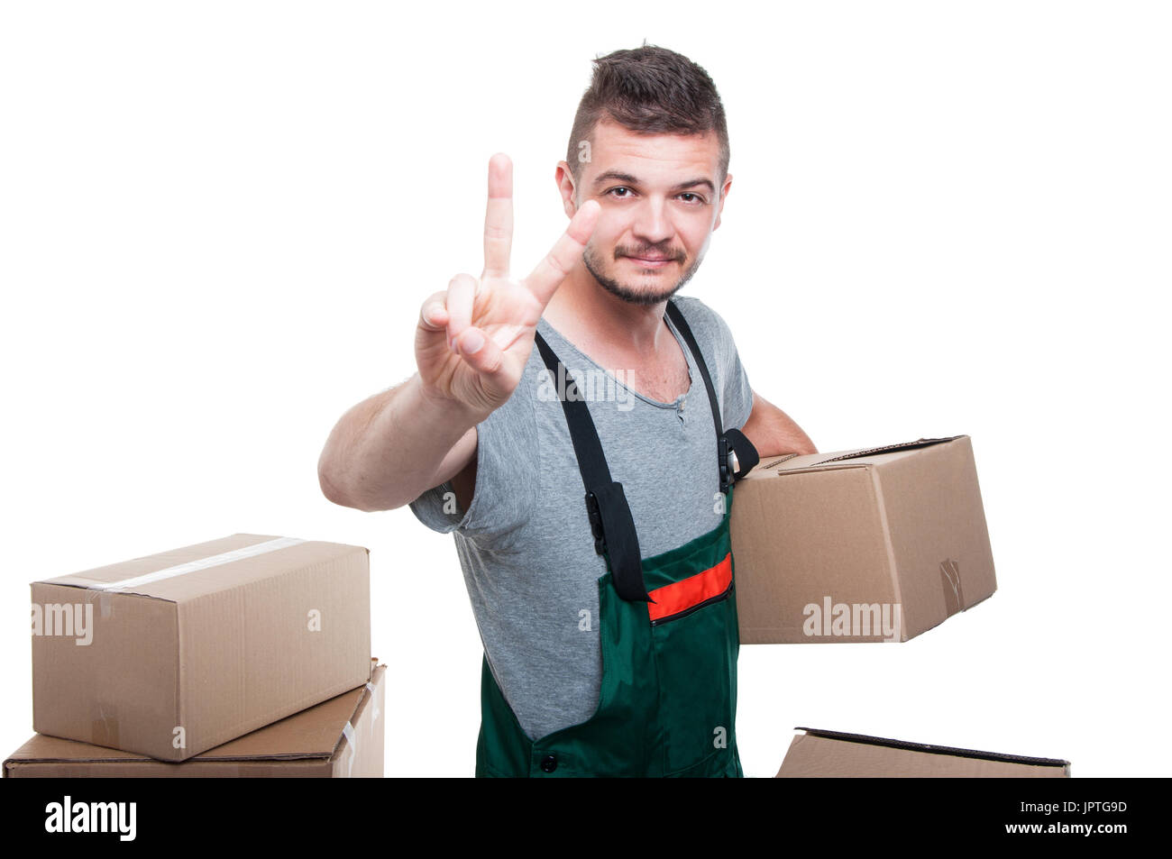 Mover guy holding cardboard box showing peace gesture and smiling ...