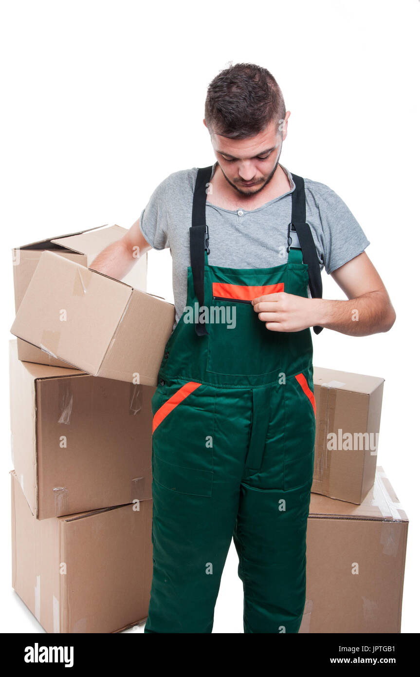 Handsome mover guy holding one box arranging his overall surrouded by ...