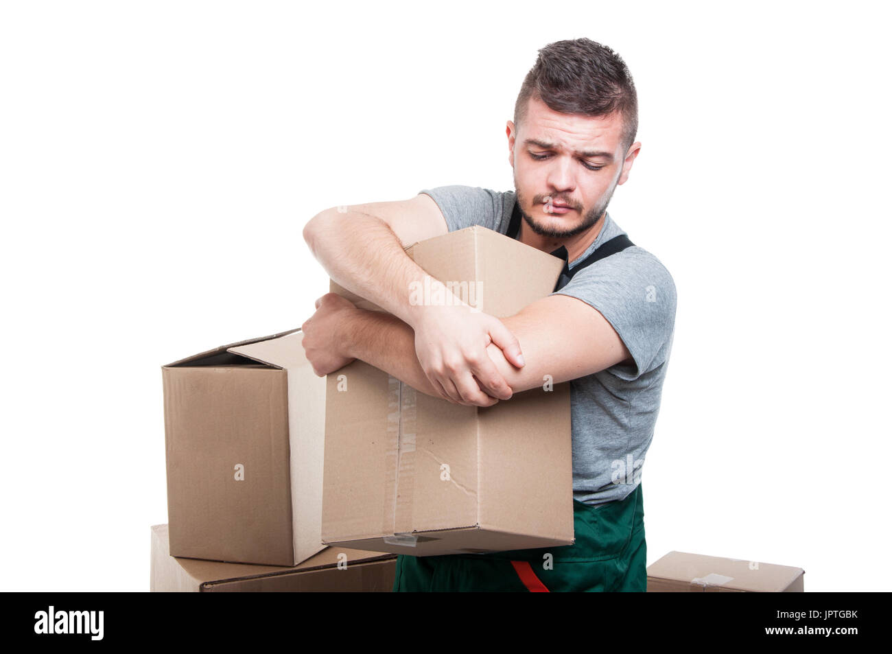 Mover man holding cardboard and his elbow like hurting isolated on ...