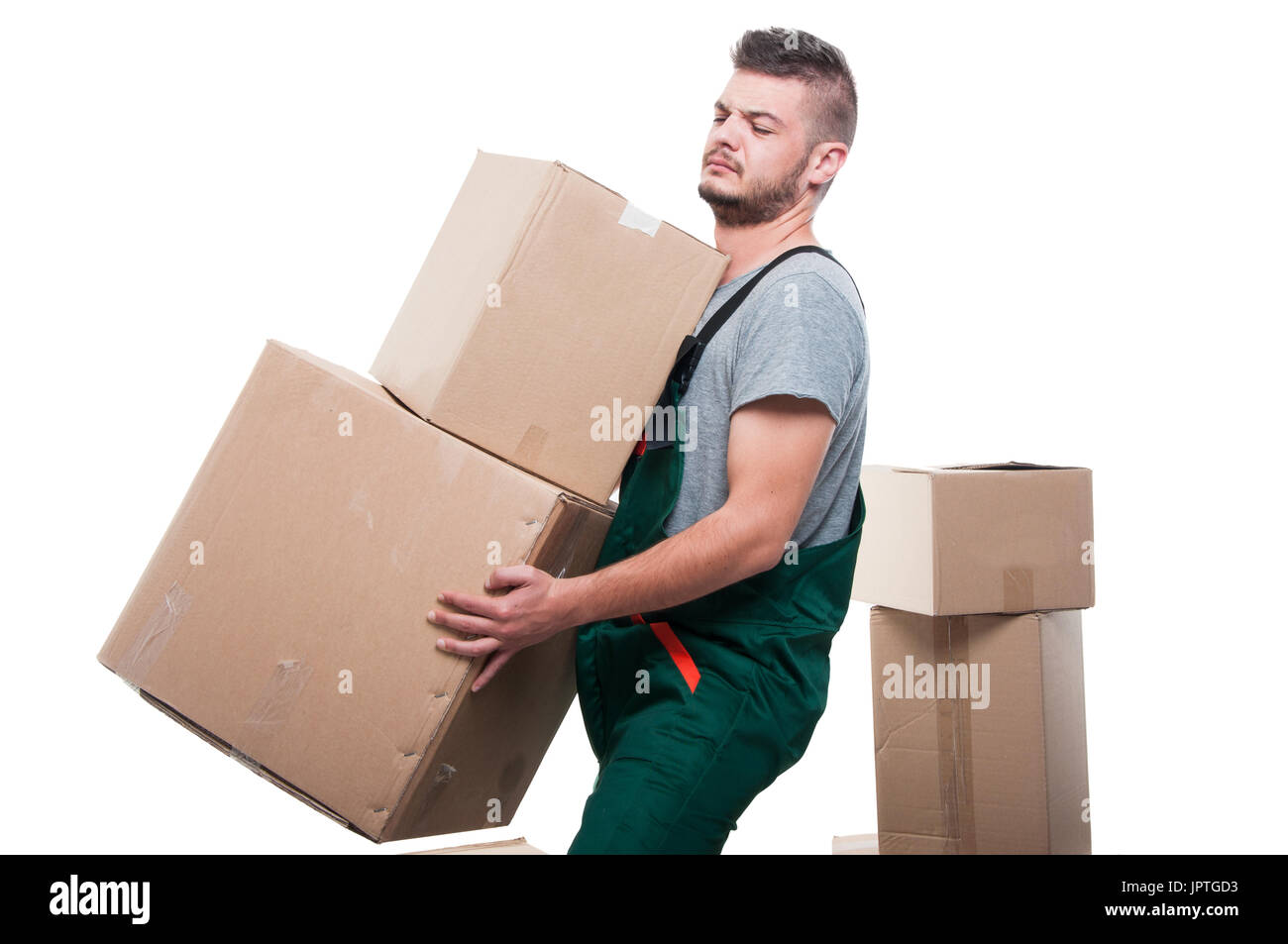 Mover guy carrying two heavy boxes looking tired isolated on white ...