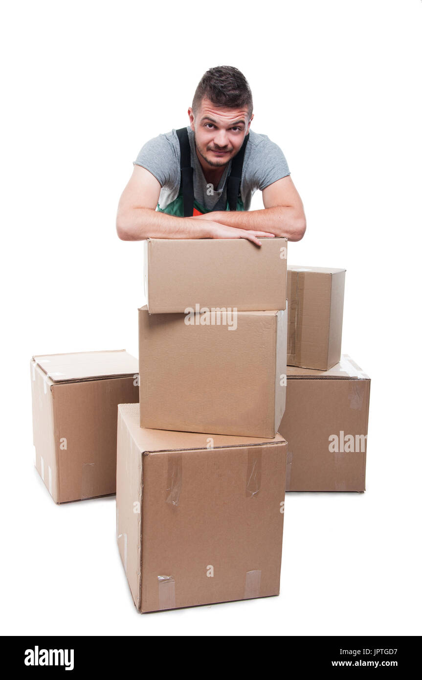 Mover man posing behind cardboard boxes isolated on white background ...