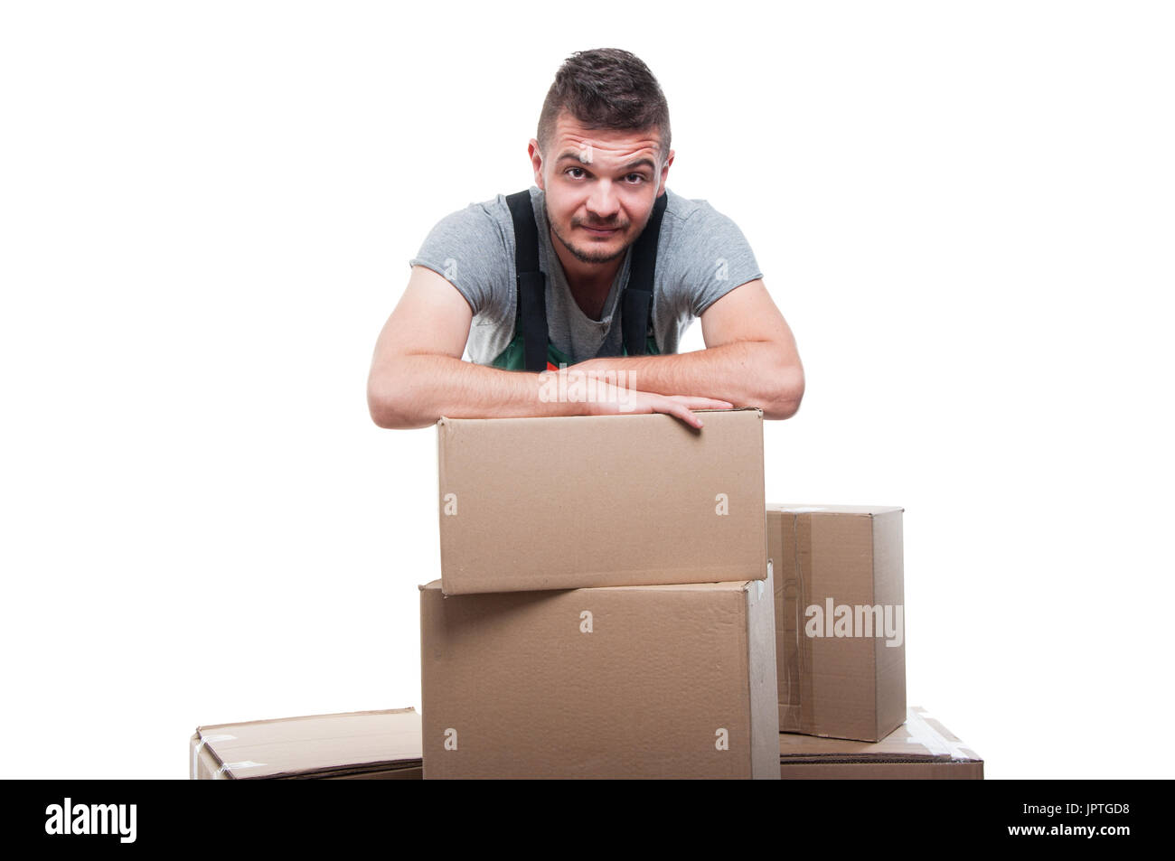 Portrait mover man posing behind cardboard boxes isolated on white ...