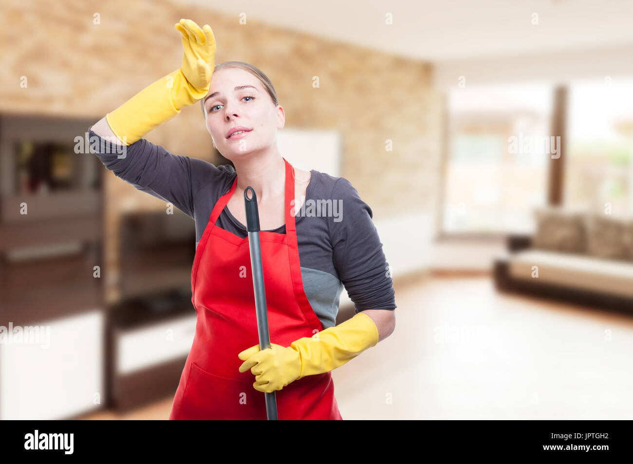 Cleaning woman being tired and exhausted after cleaning the house with ...