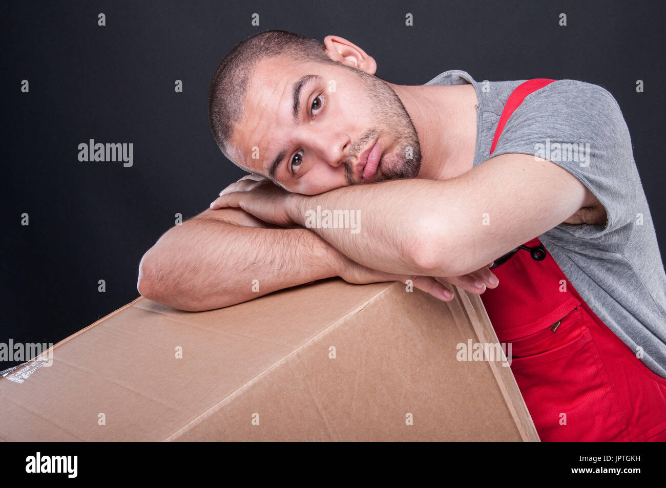 Tired delivery man box hi-res stock photography and images - Alamy
