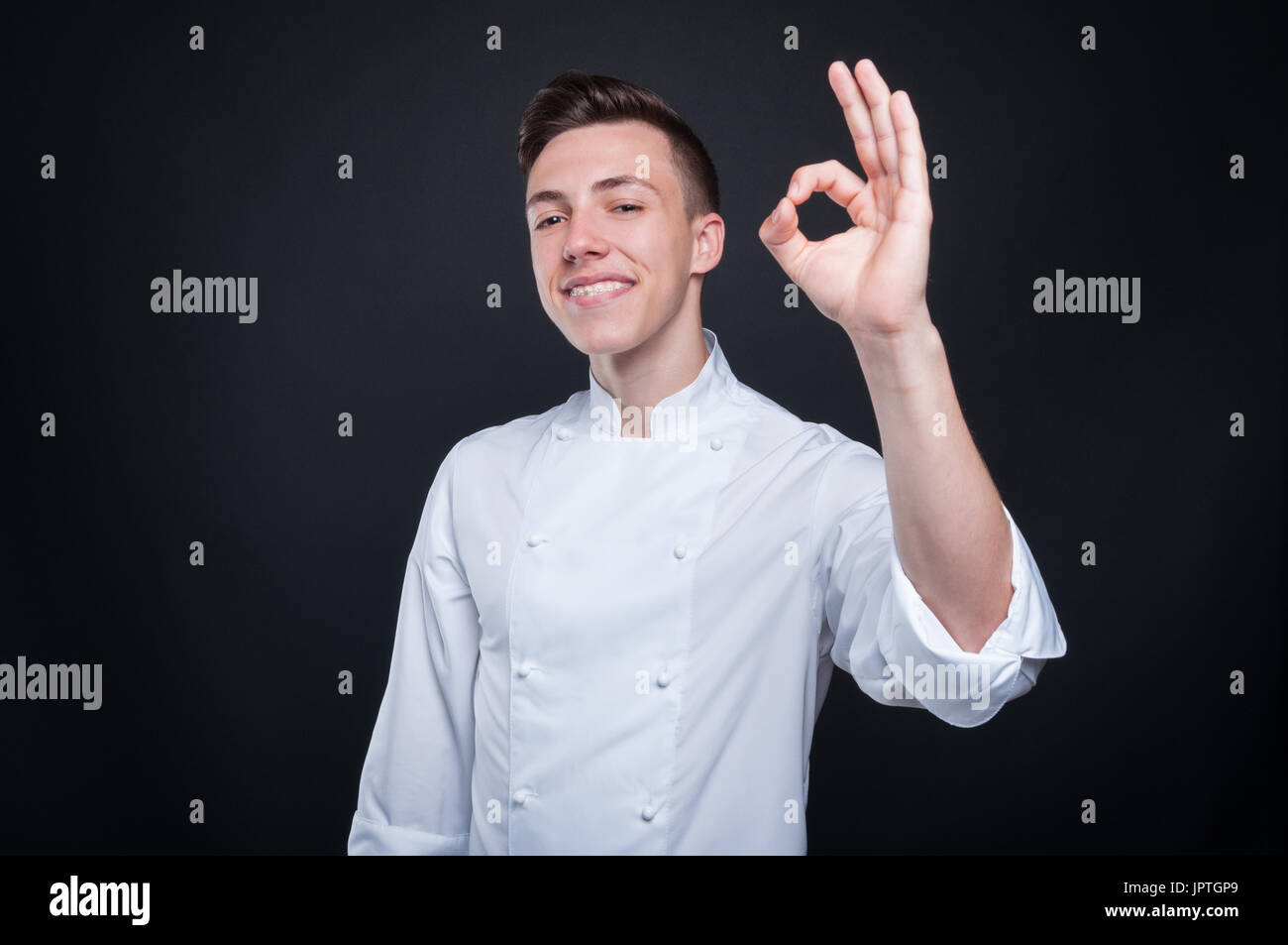 cooking, gesture and food concept - smiling female chef showing ok hand ...