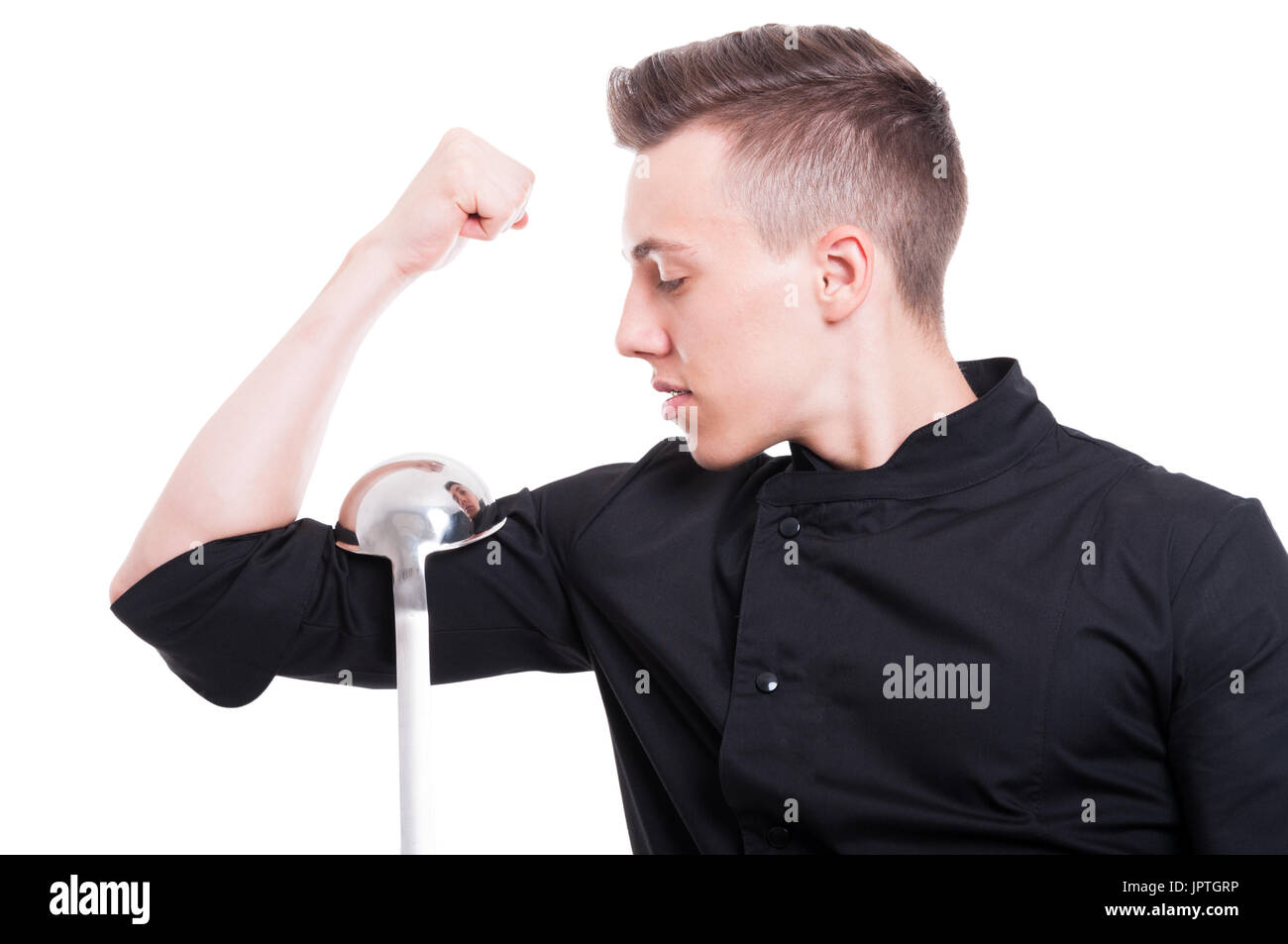 Strong and passionate chef holding ladle on biceps showing his power on ...