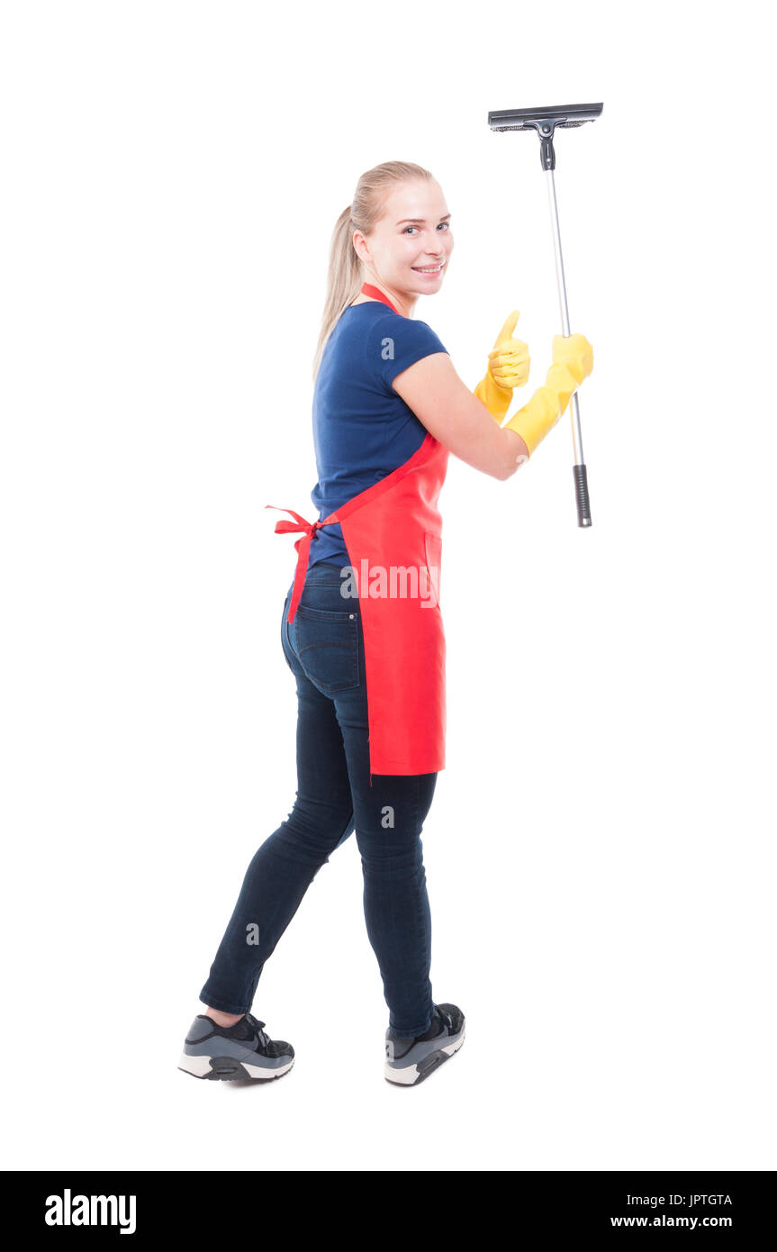 Housemaid cleaning the invisible window with scraper on white ...