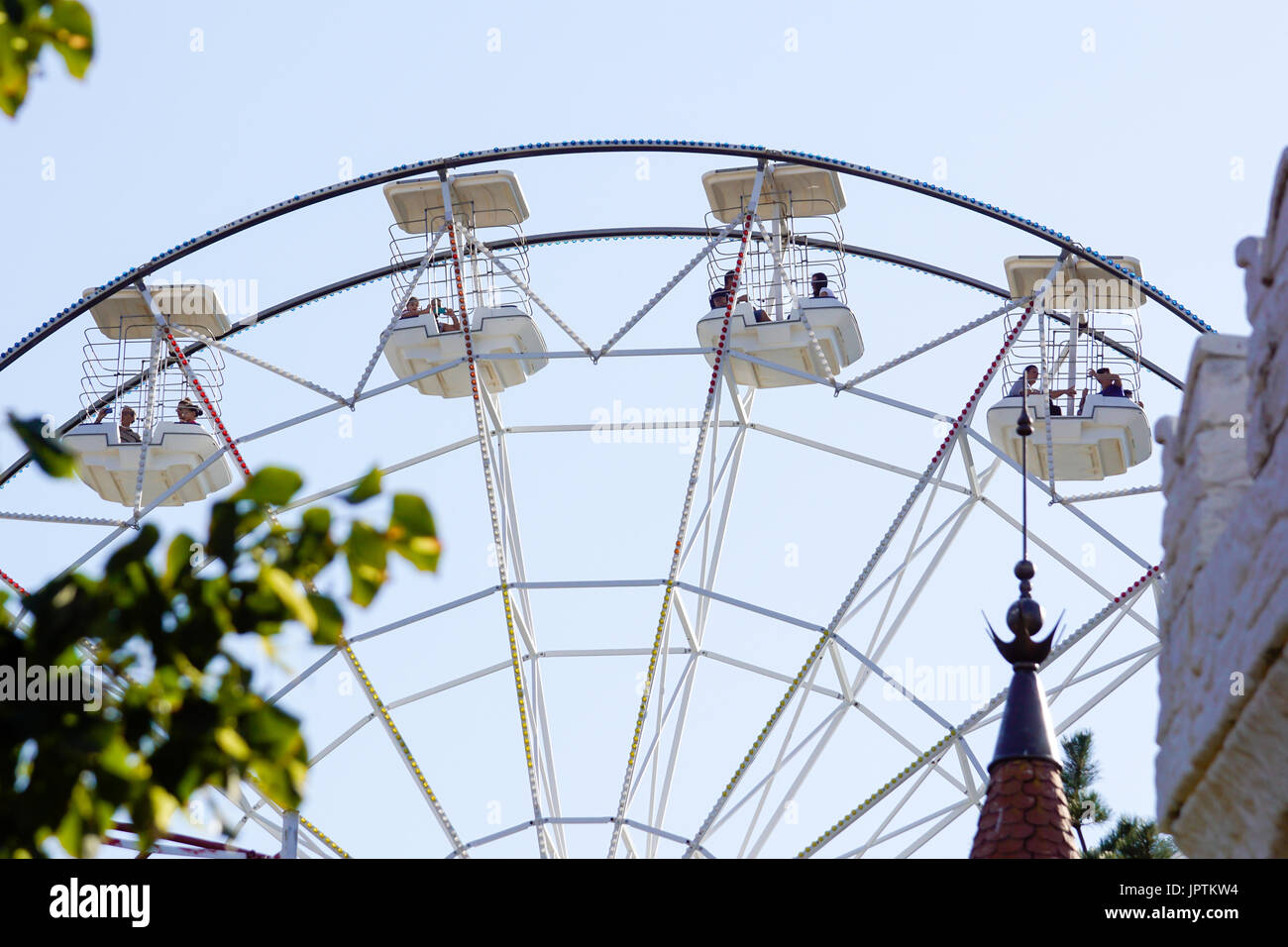 Panoramic wheel . Underside view of a ferris wheel rotating downward ...