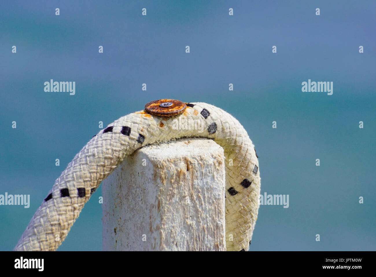 Old rope tied wooden pole hi-res stock photography and images - Alamy