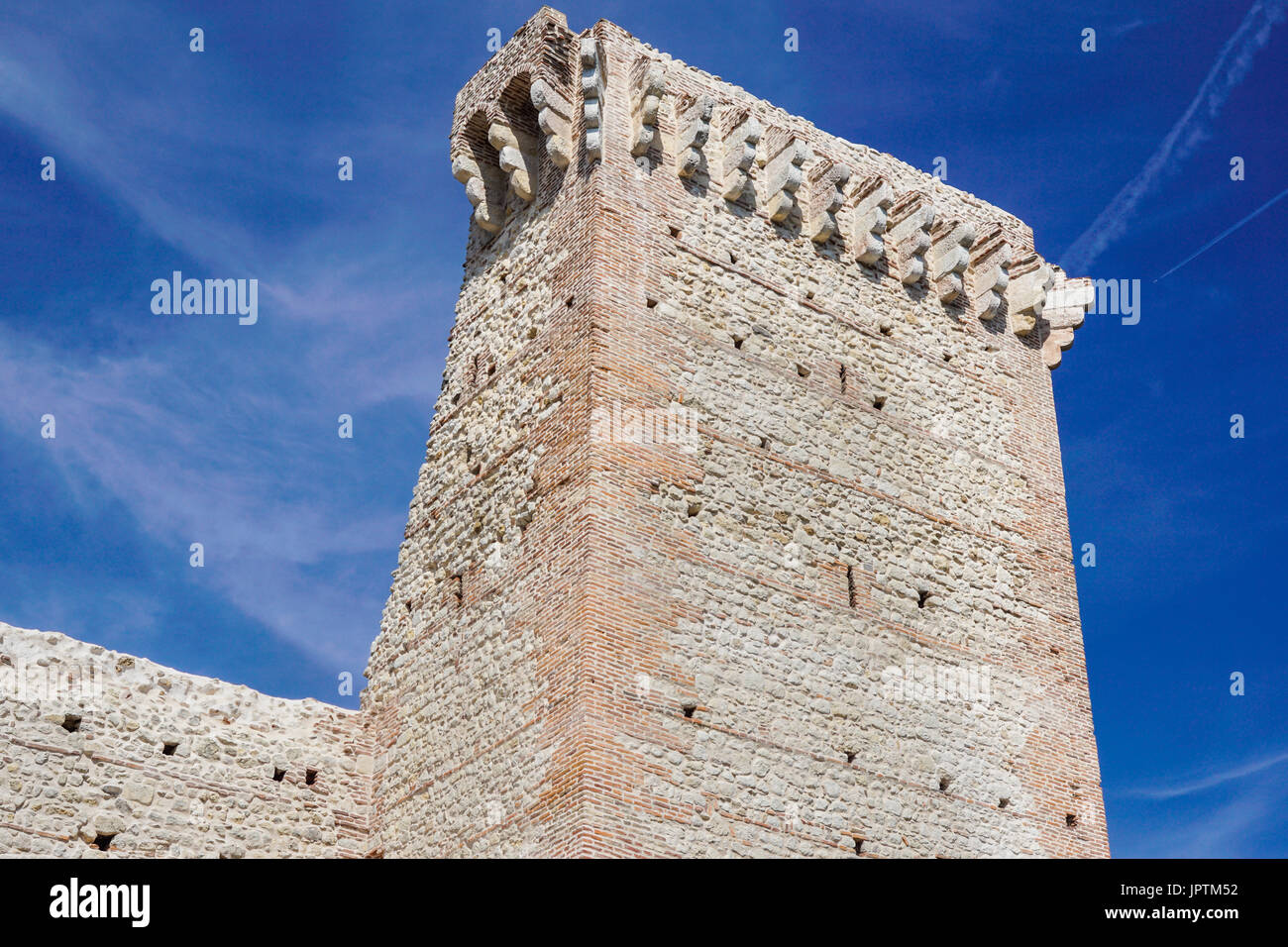 ruins of old medieval castle . fortified wall and tower detail brick ...