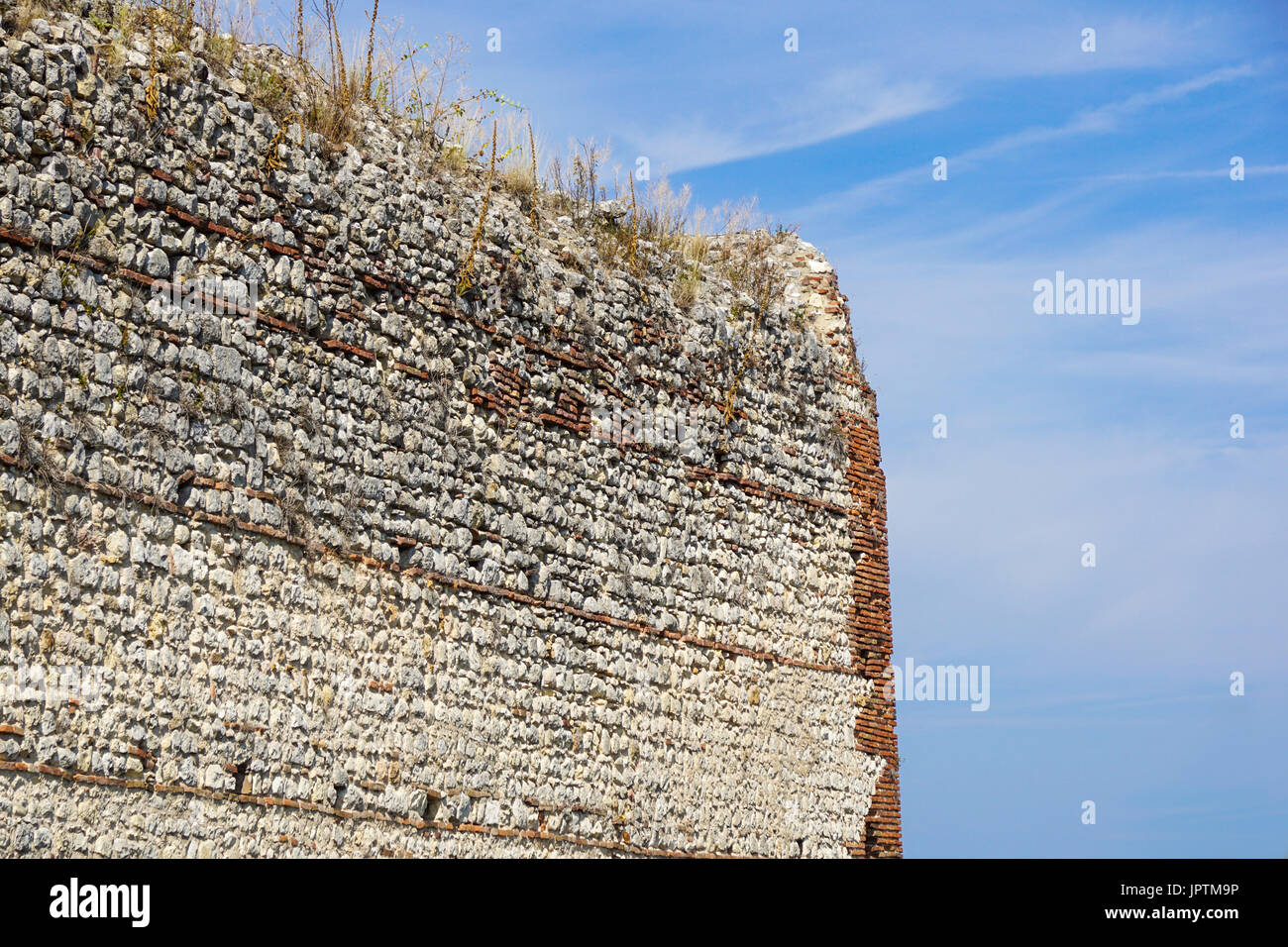 ruins of old medieval castle . fortified wall and tower detail brick ...