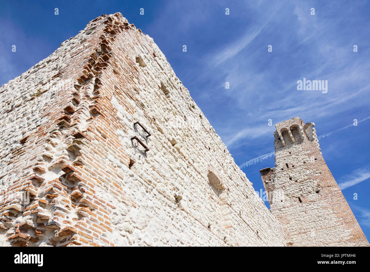 ruins of old medieval castle . fortified wall and tower detail brick ...