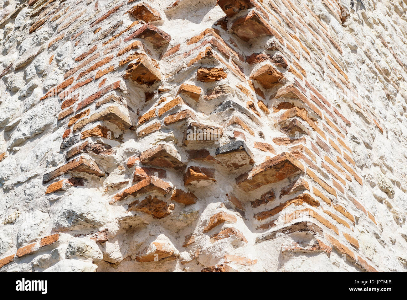 ruins of old medieval castle . fortified wall and tower detail brick ...