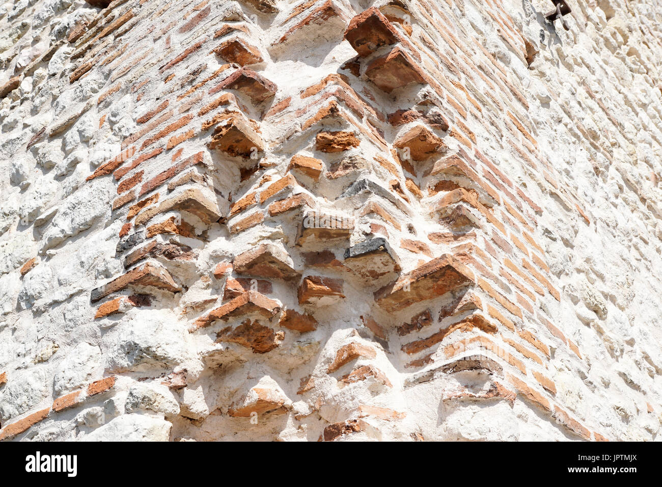 ruins of old medieval castle . fortified wall and tower detail brick ...