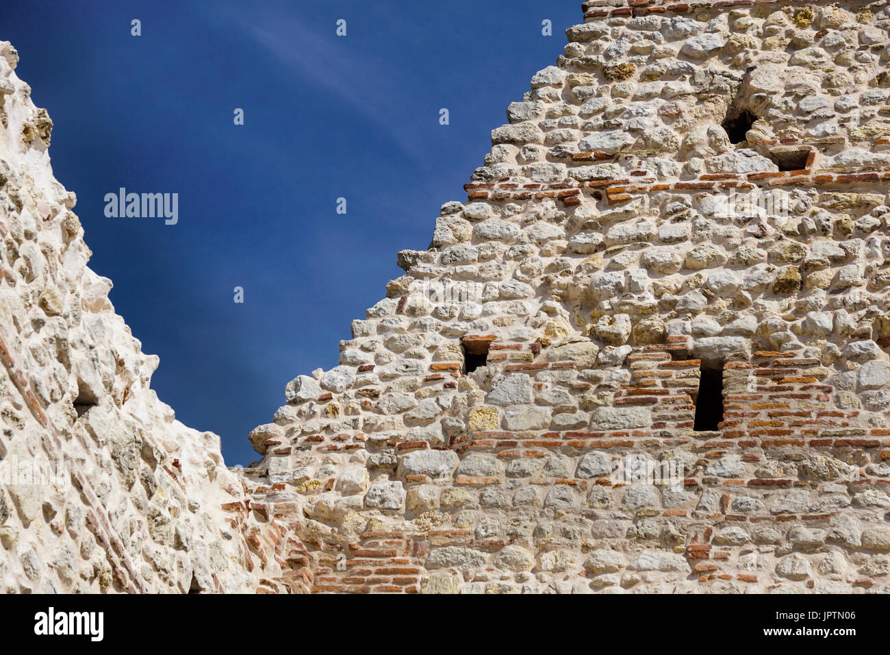 ruins of old medieval castle . fortified wall and tower detail brick ...