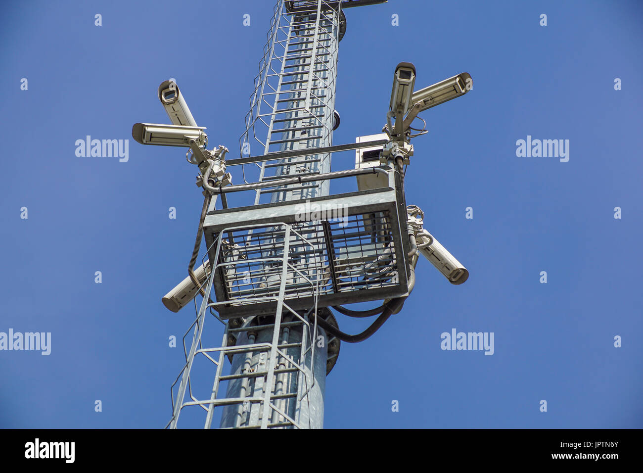 security camera on pole high tower of CCTV system in daytime Stock ...
