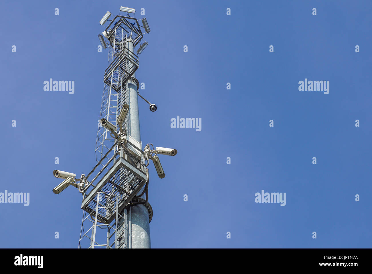 security camera on pole high tower of CCTV system in daytime Stock ...