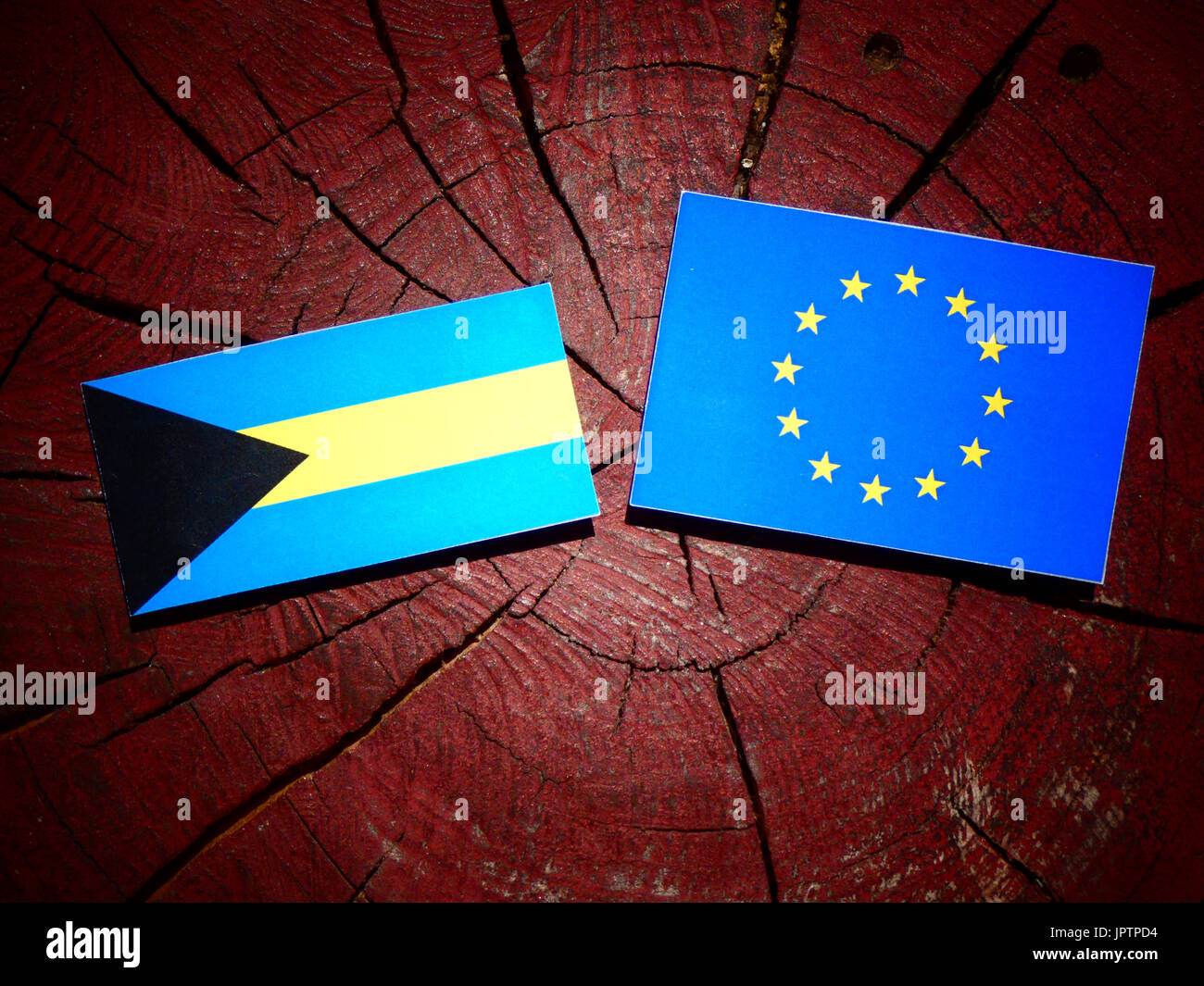 Bahamas flag with EU flag on a tree stump isolated Stock Photo - Alamy