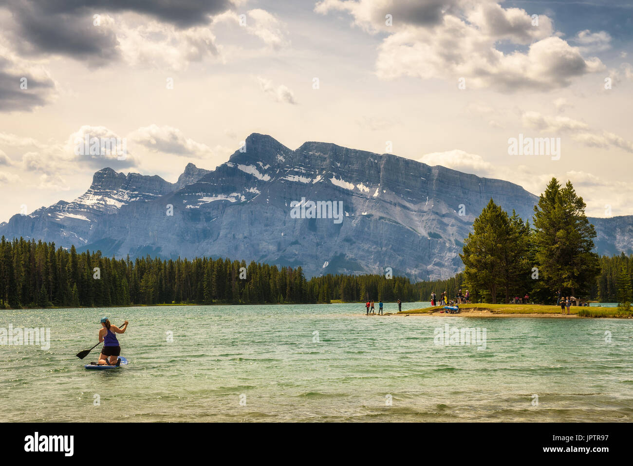 Tourists enjoy a sunny day at the two jack lake in Banff National Park ...