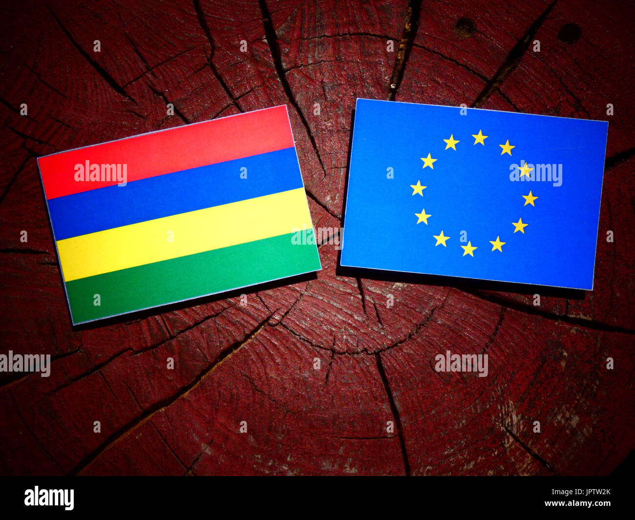 Mauritius flag with EU flag on a tree stump isolated Stock Photo - Alamy