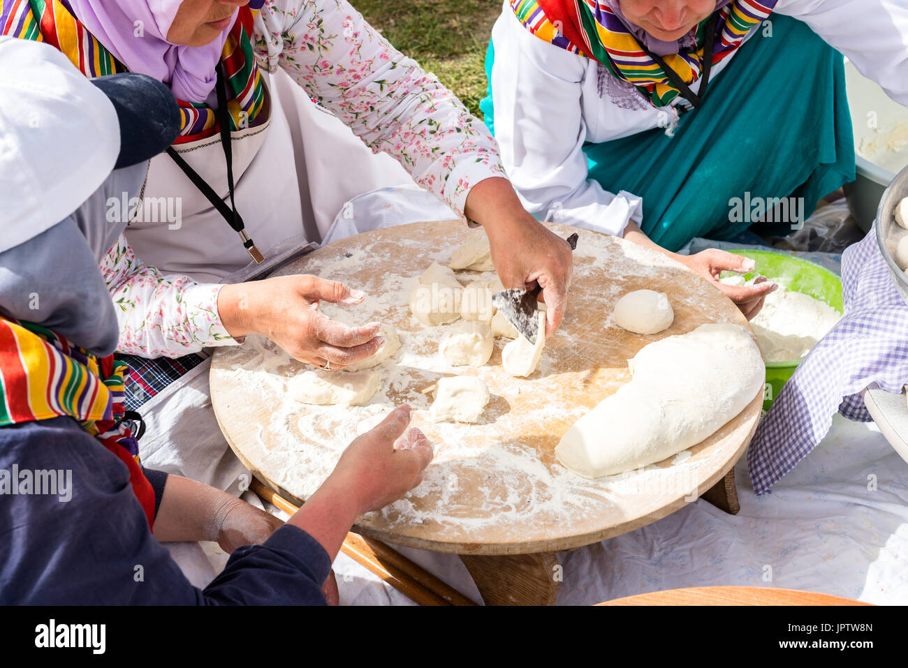Preparation of a traditional Turkish yufka for pastries - gozleme by ...