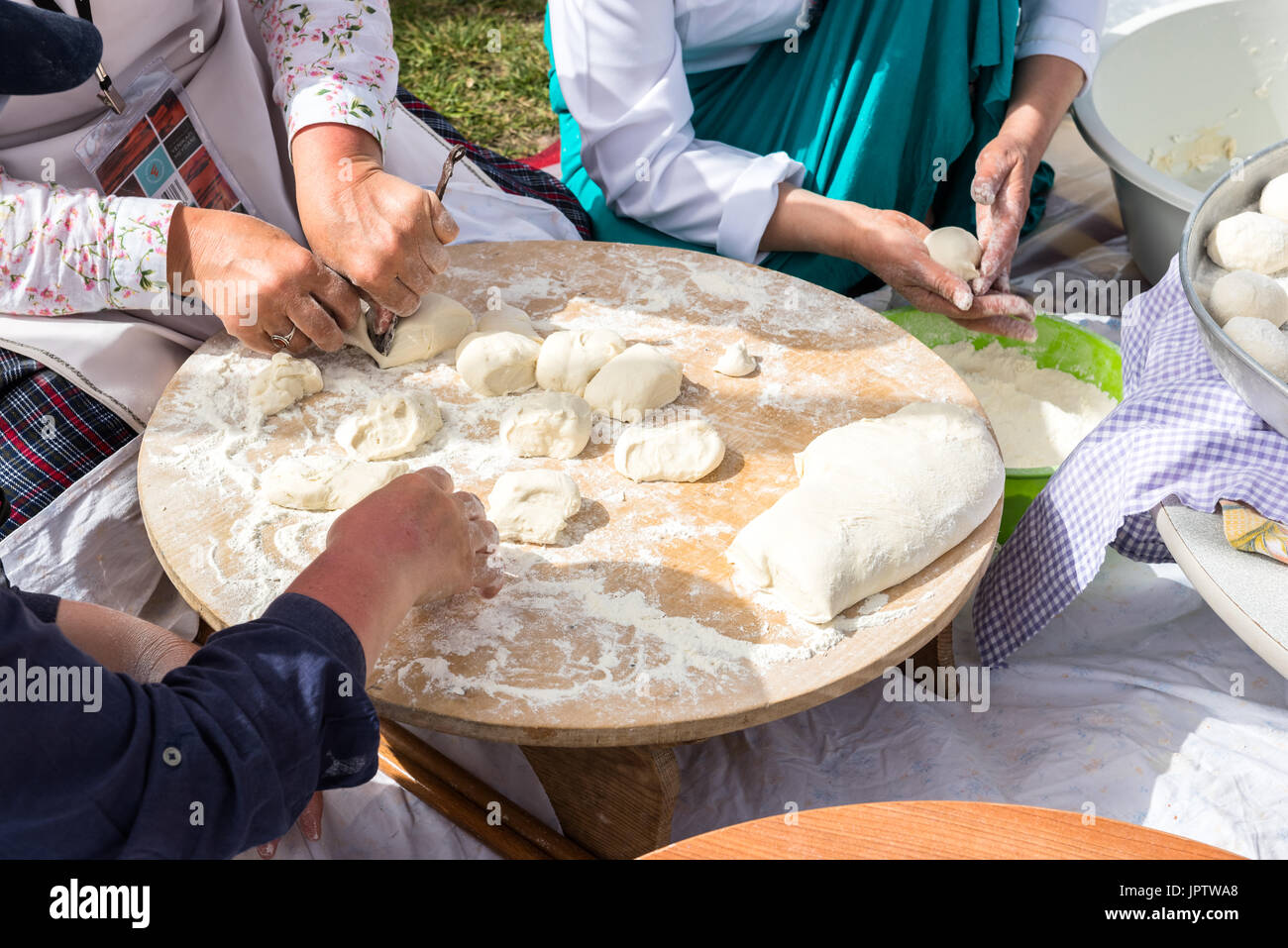 Preparation of a traditional Turkish yufka for pastries - gozleme by ...