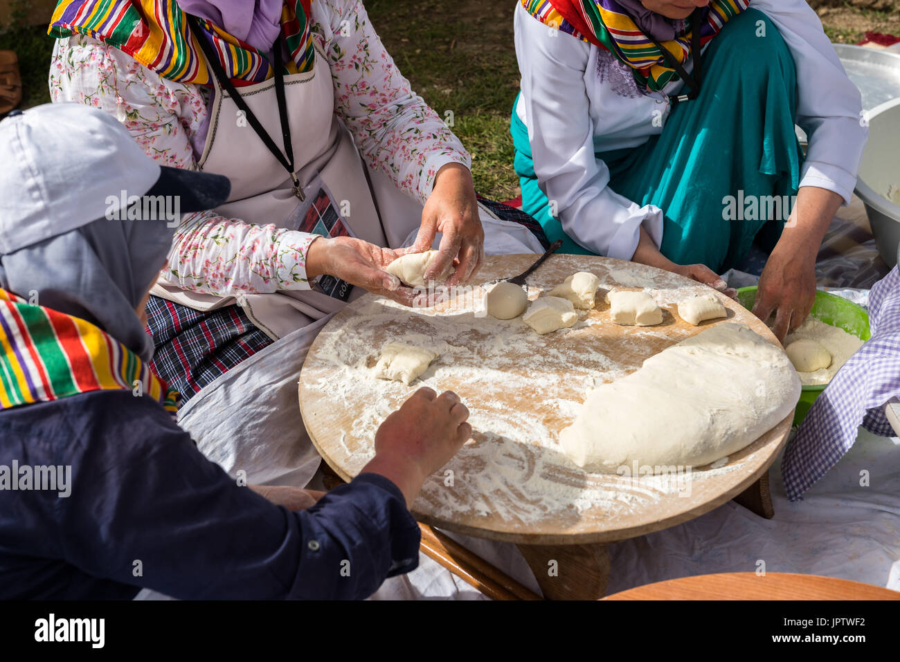 Preparation of a traditional Turkish yufka for pastries - gozleme by ...