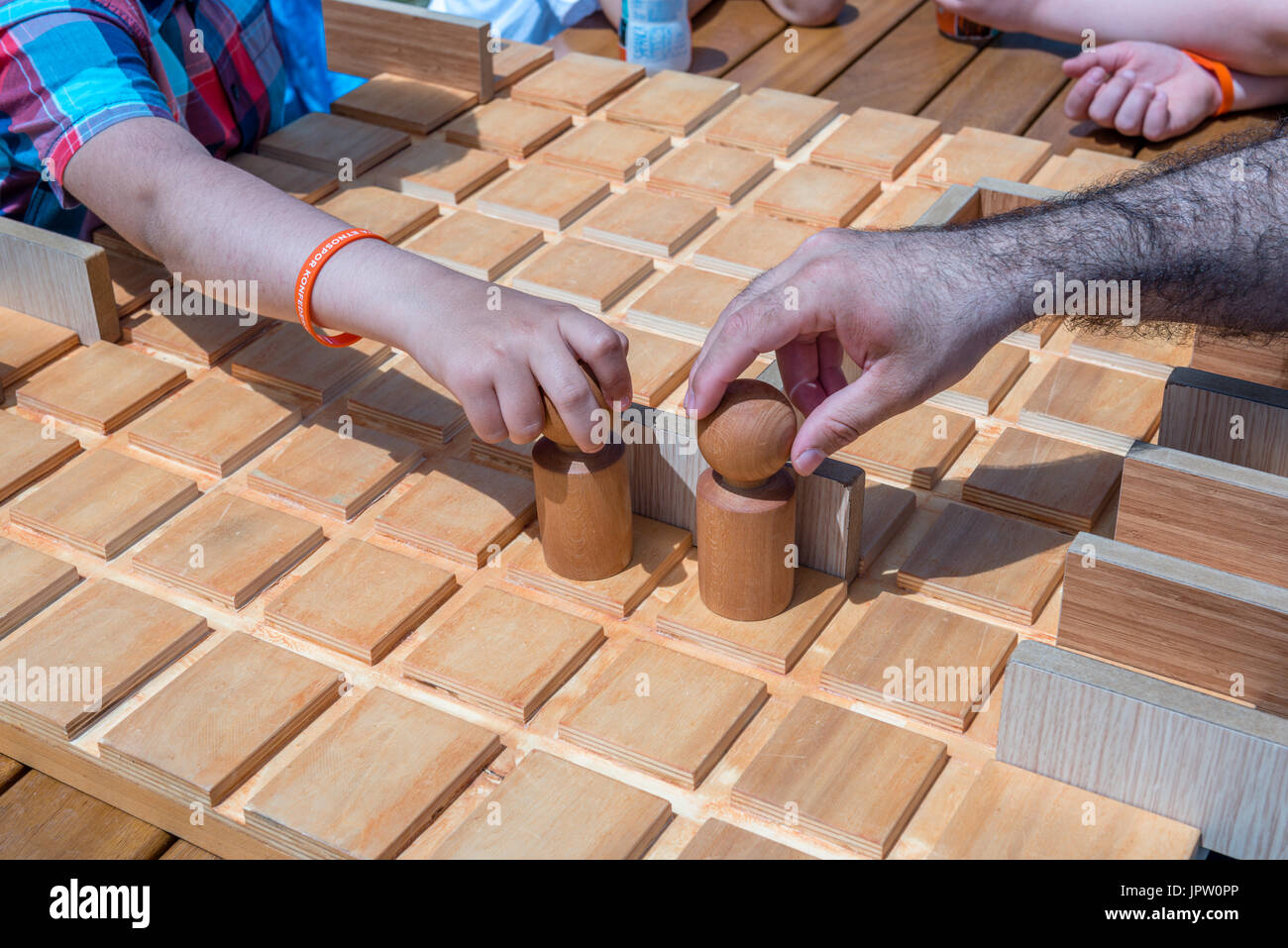 children play a traditional Turkish wooden puzzle game Stock Photo - Alamy