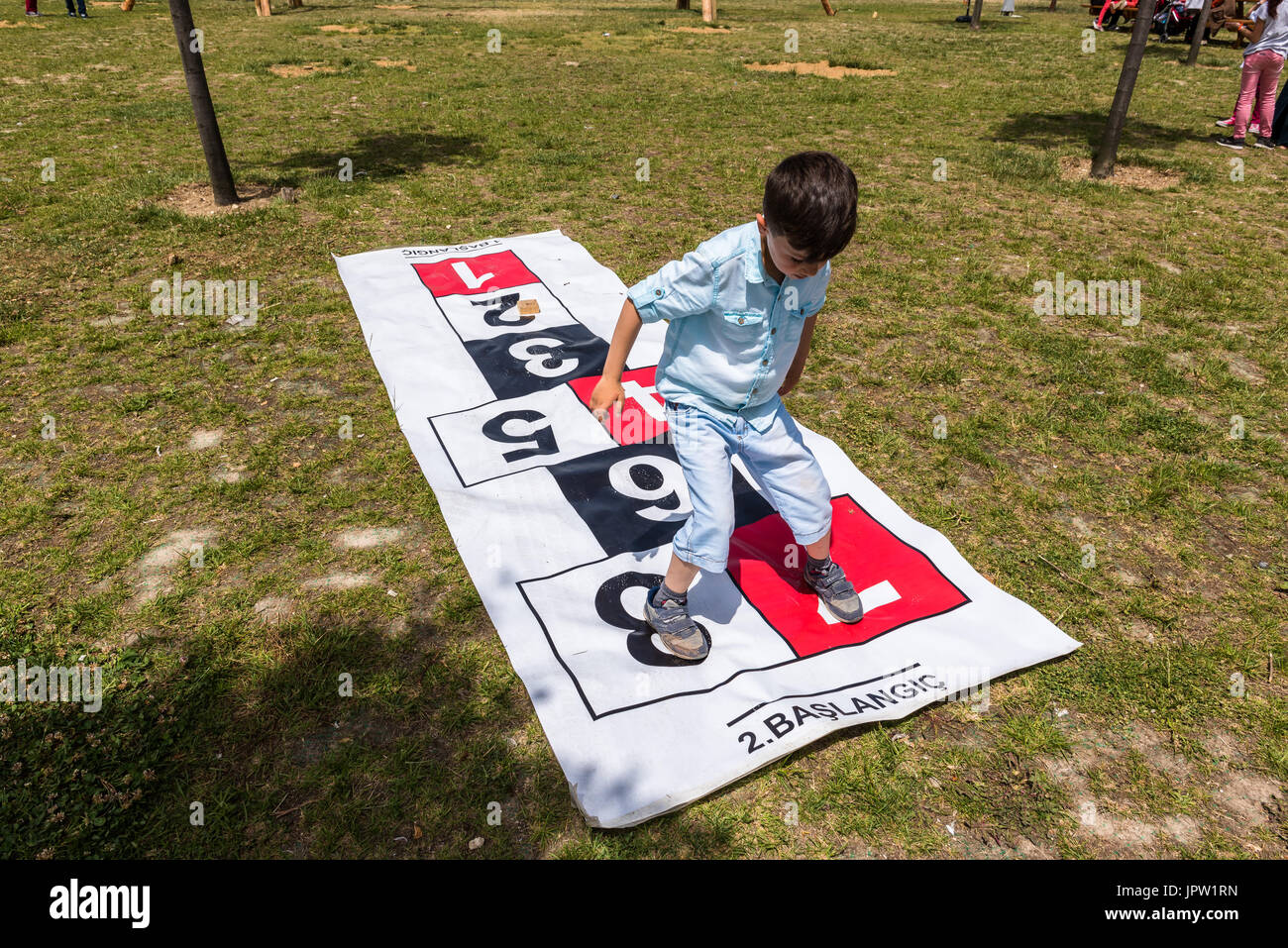 Unidentified children play a traditional Turkish game called mas(wooden ...
