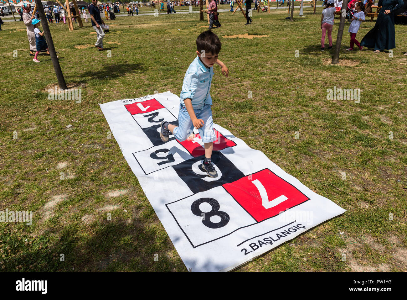 Unidentified children play a traditional Turkish game called mas(wooden ...