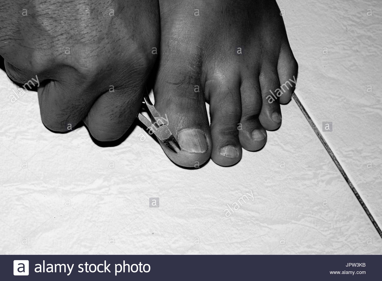 Cutting Toe Nails Stock Photos & Cutting Toe Nails Stock Images - Alamy