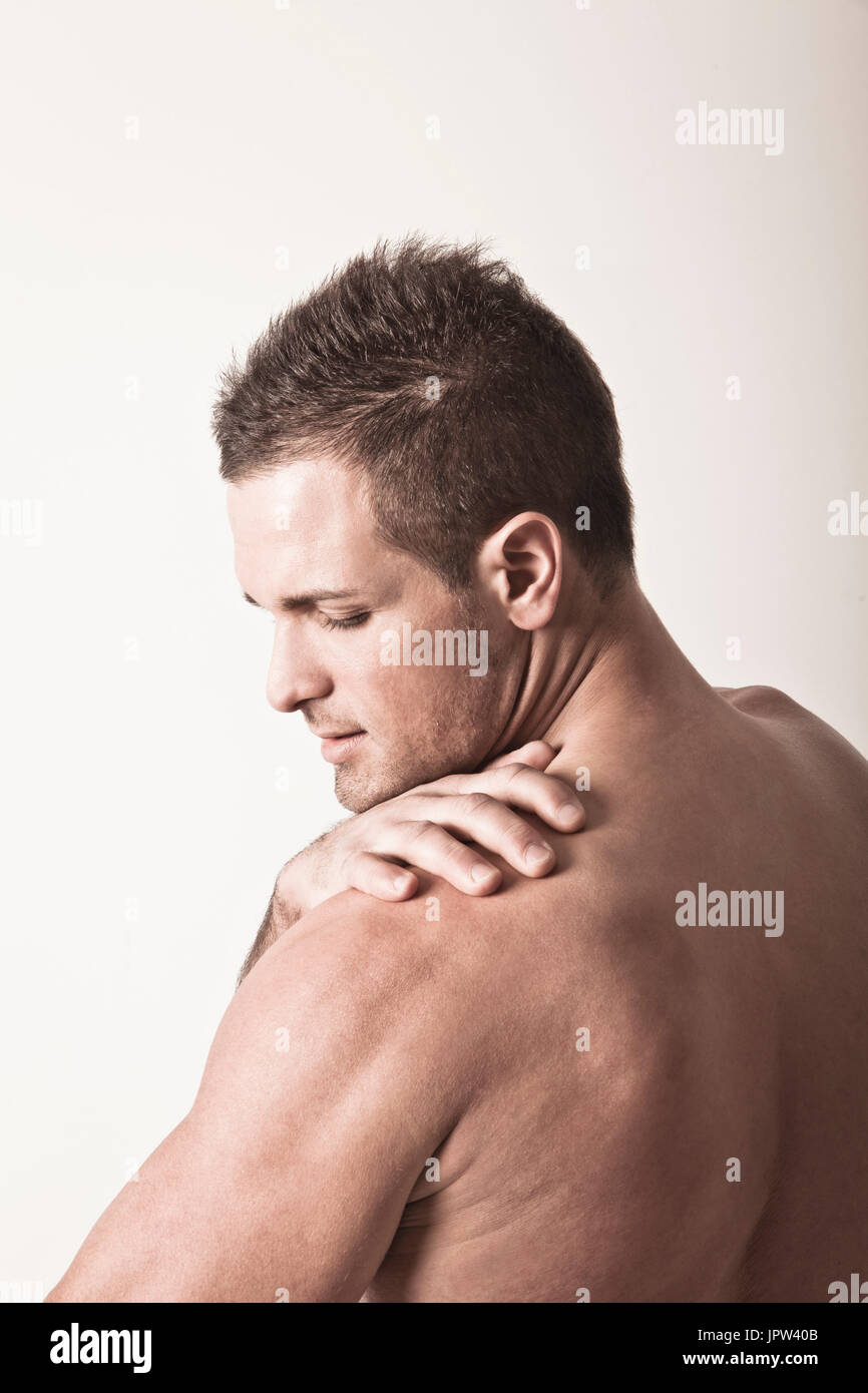 man with shoulder pain Stock Photo - Alamy
