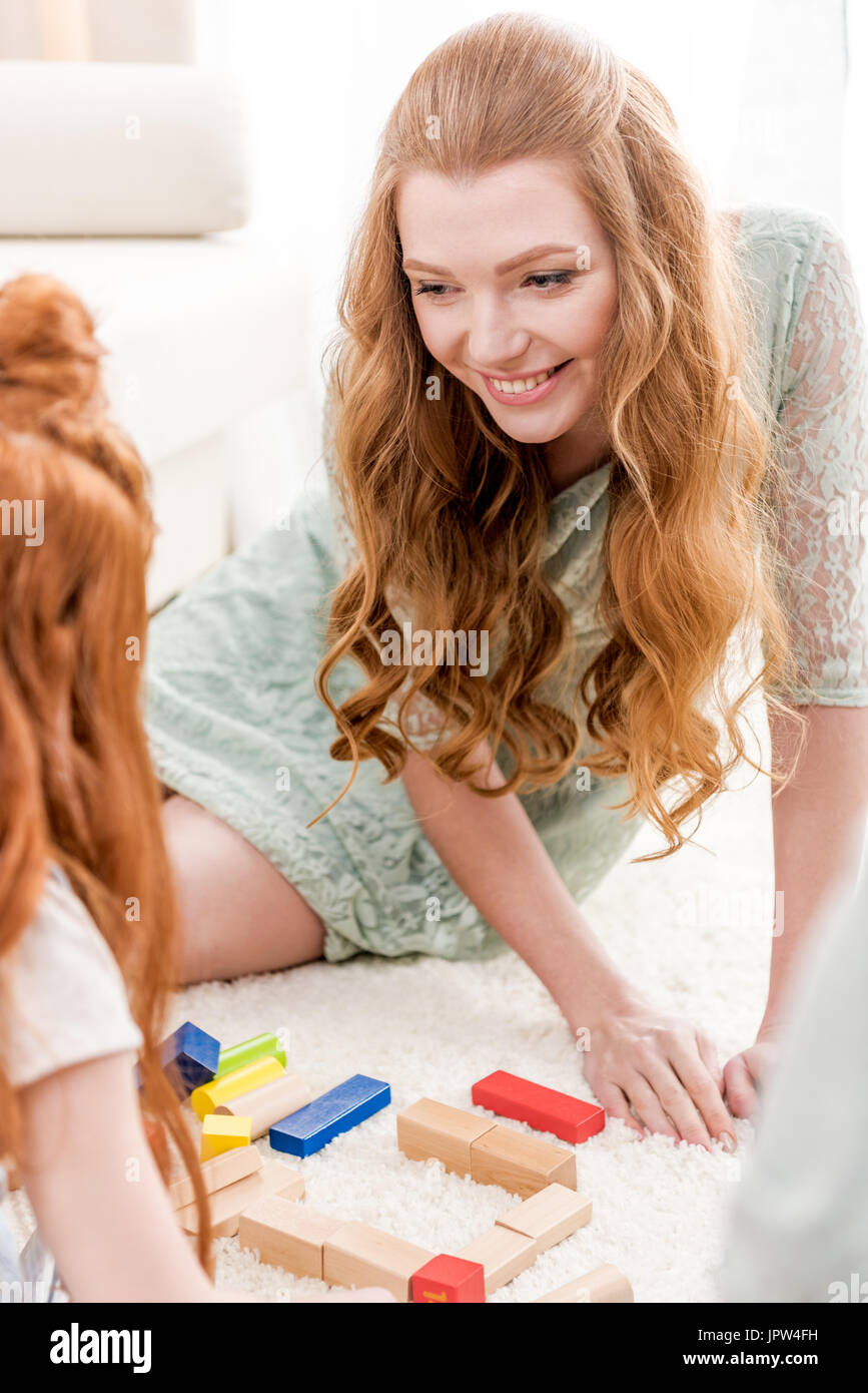 Beautiful Redhead Mother And Daughter Playing With Constructor On Floor