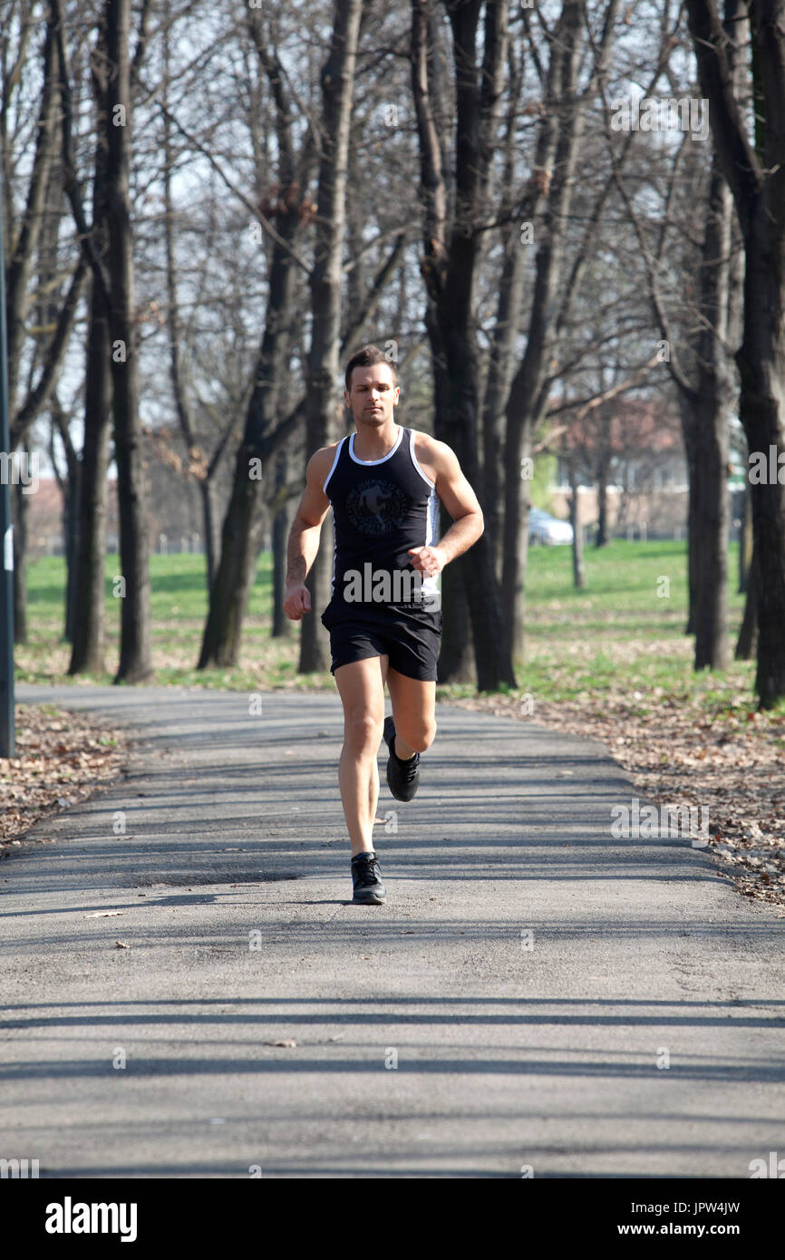 man running in the park Stock Photo - Alamy