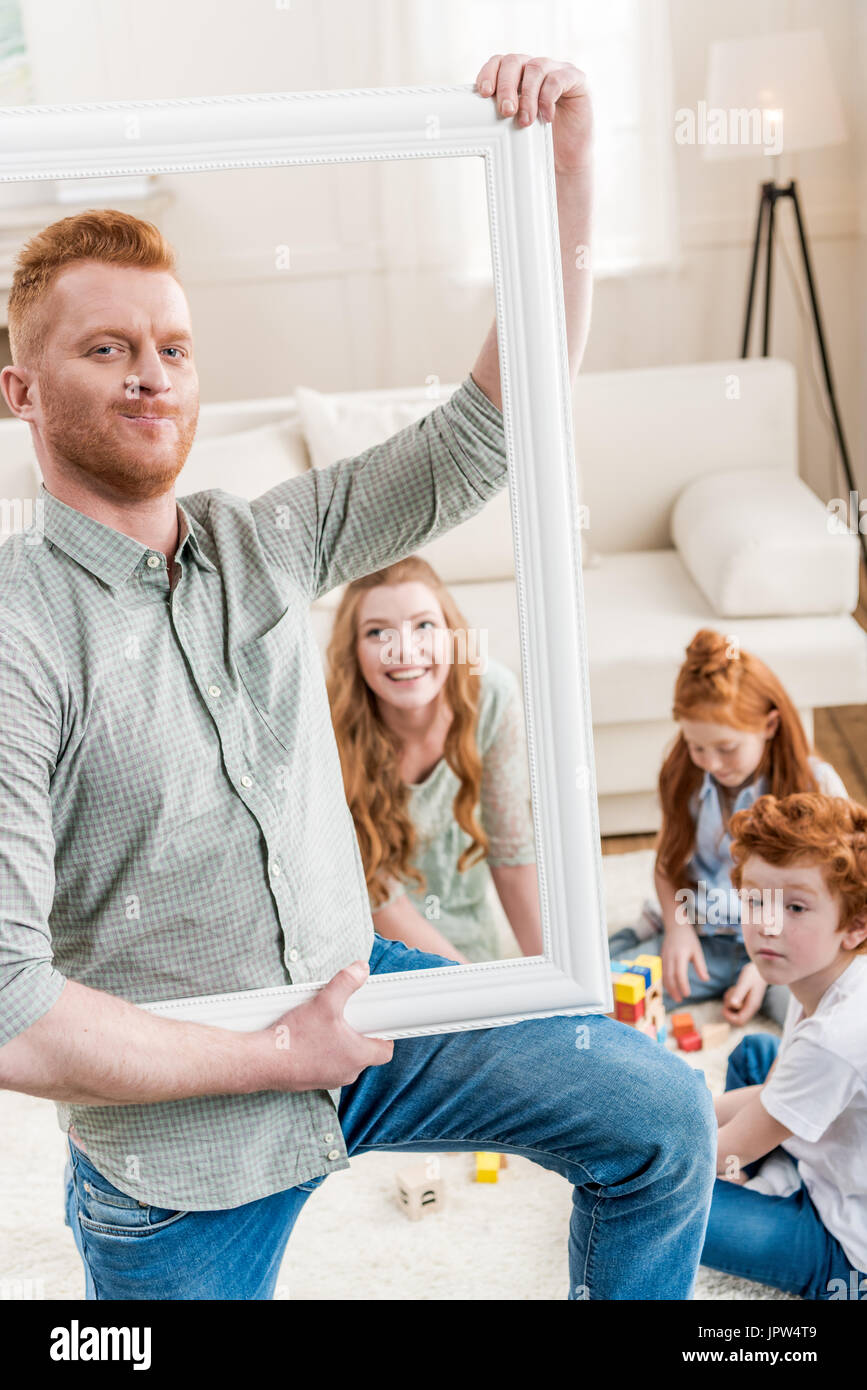 Boy looking through frame hi-res stock photography and images - Alamy