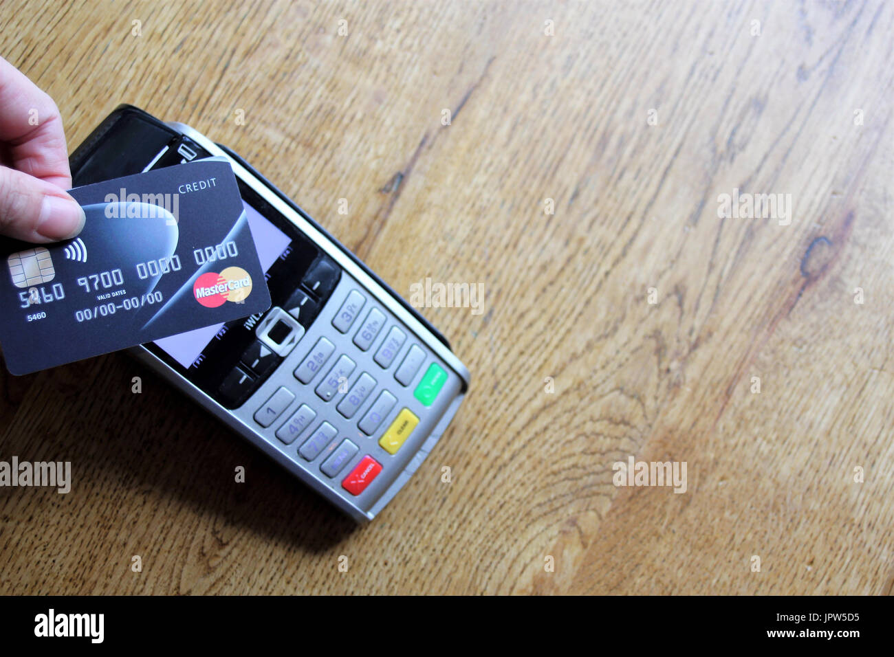 contactless payment card pdq background copy space with hand holding ...